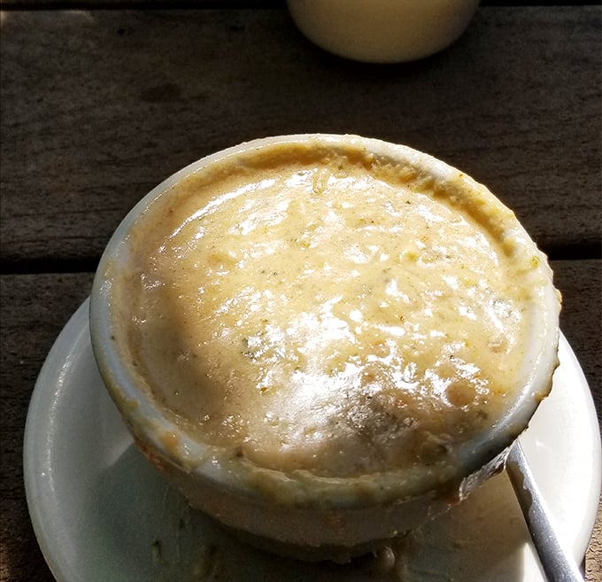 The legendary She Crab Soup arrives like a creamy cloud of seafood heaven. One spoonful and you'll understand why people make pilgrimages to Erie for this bowl.