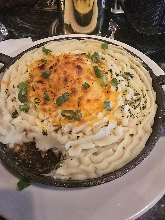 Behold the crown jewel: shepherd's pie that could make an Irishman weep, with perfectly browned potato peaks hiding savory treasures beneath.
