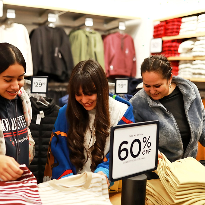 The universal language of a 60% off sign brings shoppers together in a moment of collective joy that rivals winning the lottery.