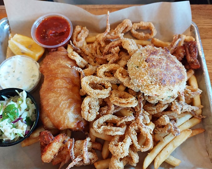 The seafood platter that launched a thousand return visits. Golden-fried perfection with three dipping sauces&mdash;because life's too short for condiment monogamy.