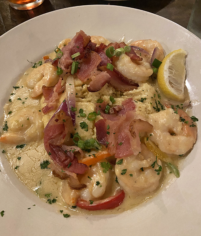 Creamy heaven with a Southern accent! Plump shrimp nestled in velvety goodness with crispy bacon &ndash; comfort food that makes you want to hug the chef.