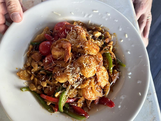 This isn't just shrimp and pasta – it's a cross-cultural romance where plump Gulf shrimp dance with hand-made spätzle, colorful peppers playing cheerful chaperones.