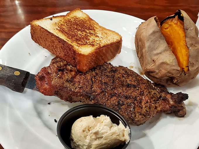 Perfectly charred sirloin meets golden garlic toast and a sweet potato bursting with promise. A plate that understands the meaning of "simple done right."