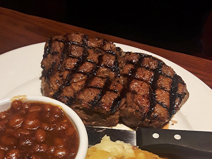 This isn't just a steak; it's a masterpiece of crosshatched grill marks and juicy perfection that makes vegetarians question their life choices.