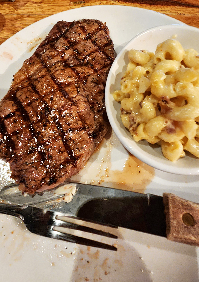 A perfectly grilled sirloin alongside creamy mac and cheese&mdash;proof that sometimes the simplest combinations create the most profound happiness.
