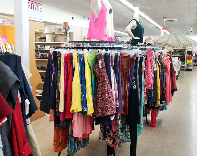 The rainbow of fabrics tells a fashion story spanning decades. One rack might contain both your mother's prom dress and next season's retro trend.