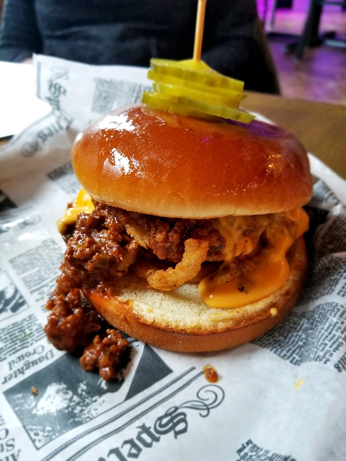 This isn't just a burger; it's an architectural masterpiece of beef, cheese, and pickles. The glossy bun roof shelters a neighborhood of flavors that get along surprisingly well.