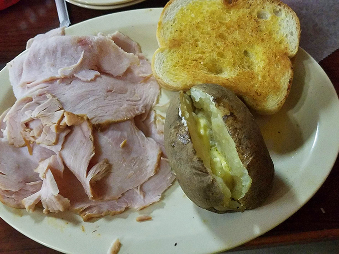 Smoked turkey that doesn't need a holiday to shine. That butter-soaked baked potato isn't just a side&mdash;it's a co-star in this delicious production.