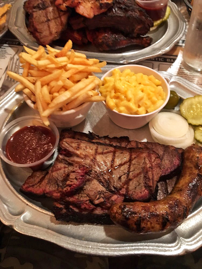 BBQ platter nirvana: Smoke-kissed meats sharing real estate with golden fries and mac & cheese that's unapologetically creamy. Diet plans, consider yourselves on vacation.
