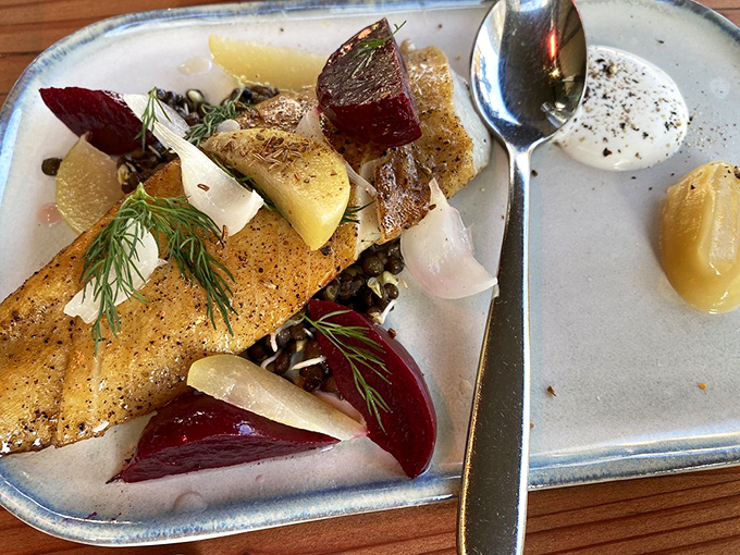 The smoked fish arrives like a colorful still life painting you can eat. Those root vegetables and fresh herbs aren't just garnish&mdash;they're supporting actors in this delicious drama.