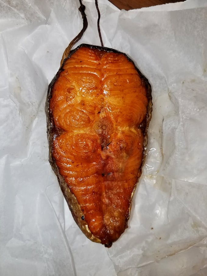 This salmon steak looks like it was painted by Rembrandt, if Rembrandt worked exclusively in smoke and fire.