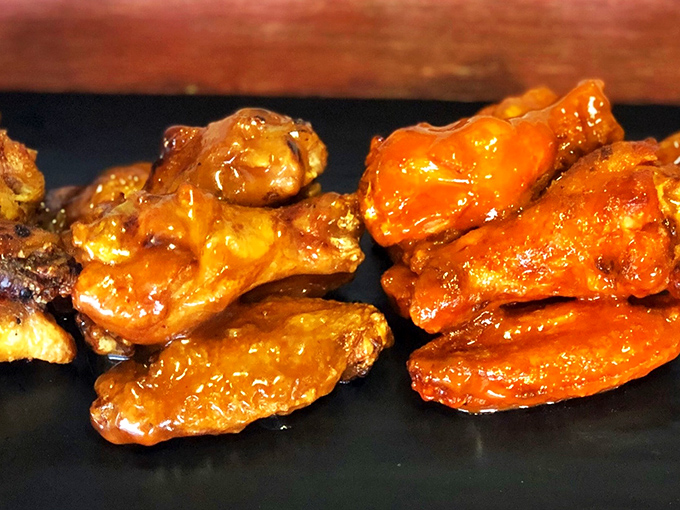 These glazed beauties prove that patience and smoke can transform ordinary wings into extraordinary obsessions worth driving for.