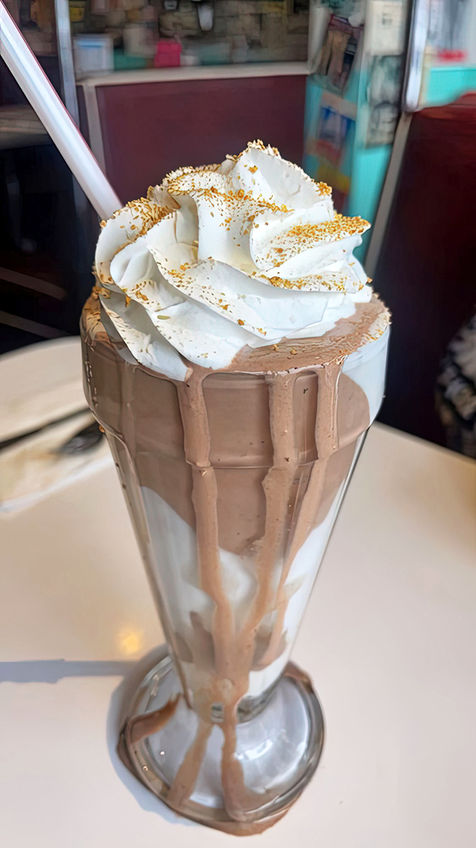 Not all heroes wear capes, but some milkshakes wear crowns. This chocolate creation with its whipped cream tower demands respect&mdash;and a bigger straw.