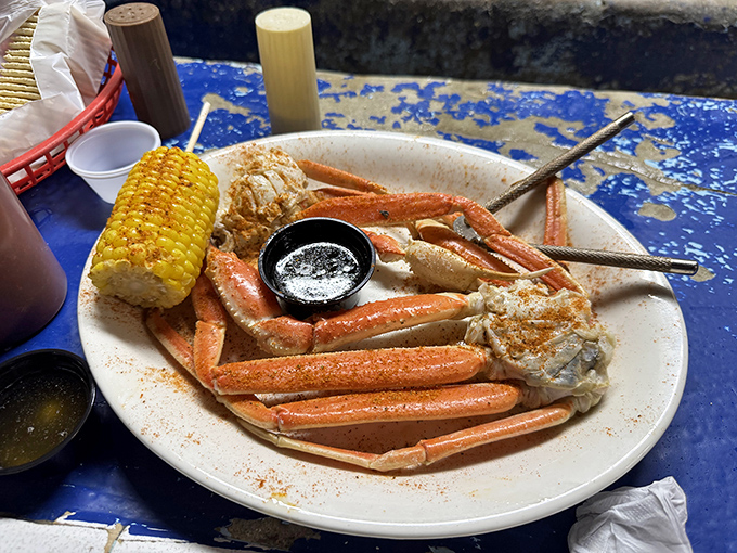 Snow crab legs splayed across the plate like nature's puzzle&mdash;a delicious challenge that rewards patience with sweet, tender meat.