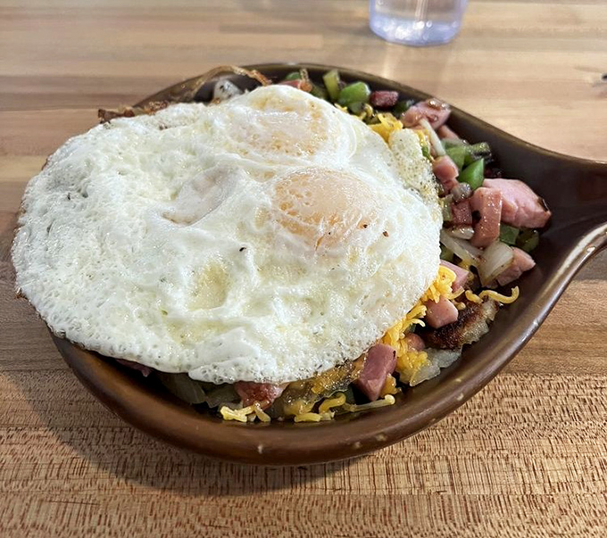 Eggs that know exactly what they're doing, perched atop a mountain of savory ingredients. This skillet doesn't just feed you&mdash;it prepares you for adventure.