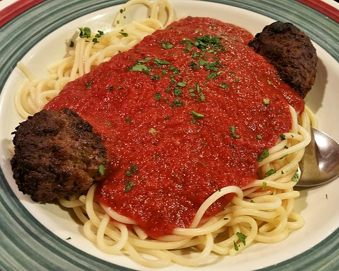 Spaghetti and meatballs that would make your Italian grandmother weep with joy—or jealousy. Those meatballs aren't just big; they're commitment-sized.