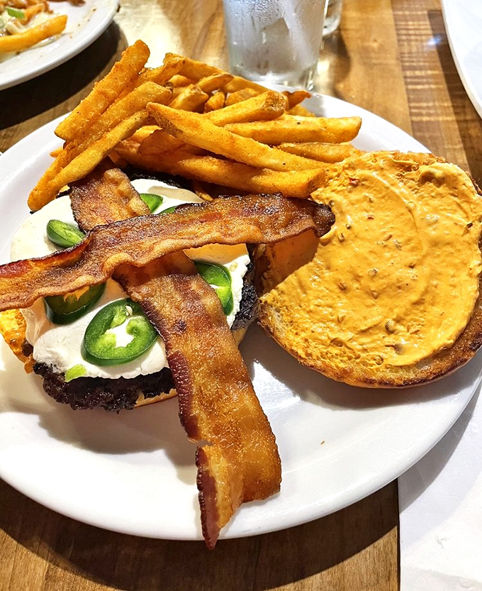 The Spicy Goat Burger arrives like a flavor explosion, with jalape&ntilde;os and goat cheese playing the perfect spicy-creamy duet.