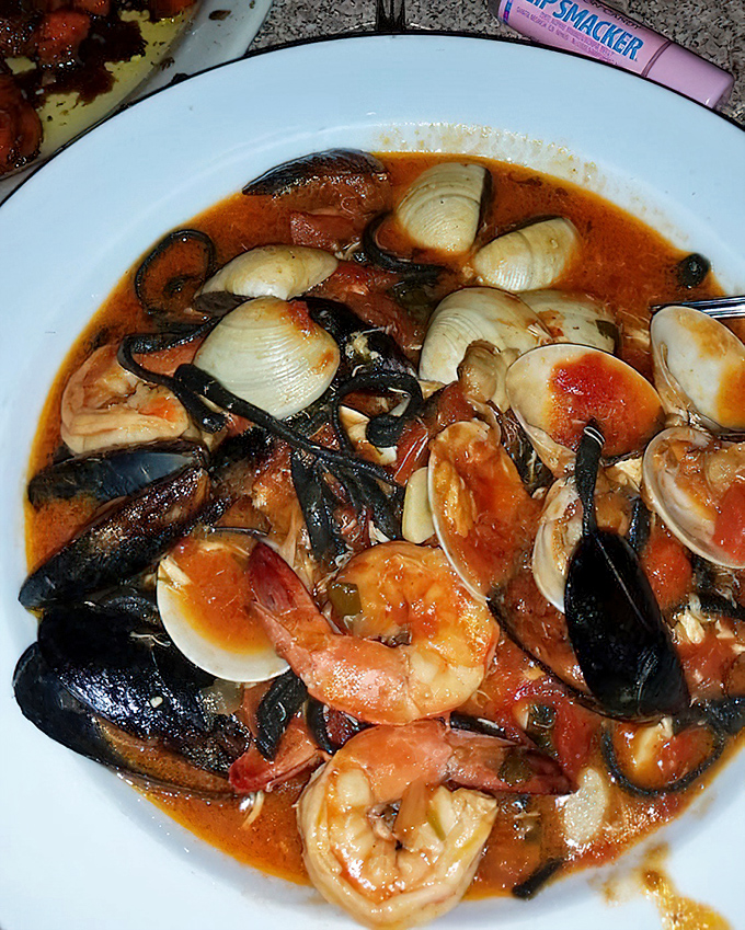 Seafood stew that would make Neptune himself request seconds. Those mussels and shrimp are having the world's most delicious pool party.