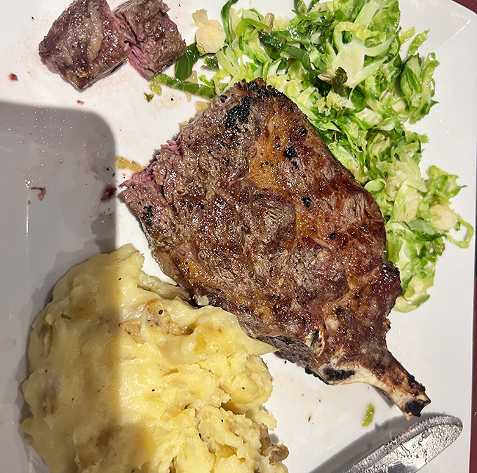 A perfectly seared steak with just the right char marks&mdash;nature's artwork on a plate. The mashed potatoes aren't just a side; they're a buttery cloud of comfort.