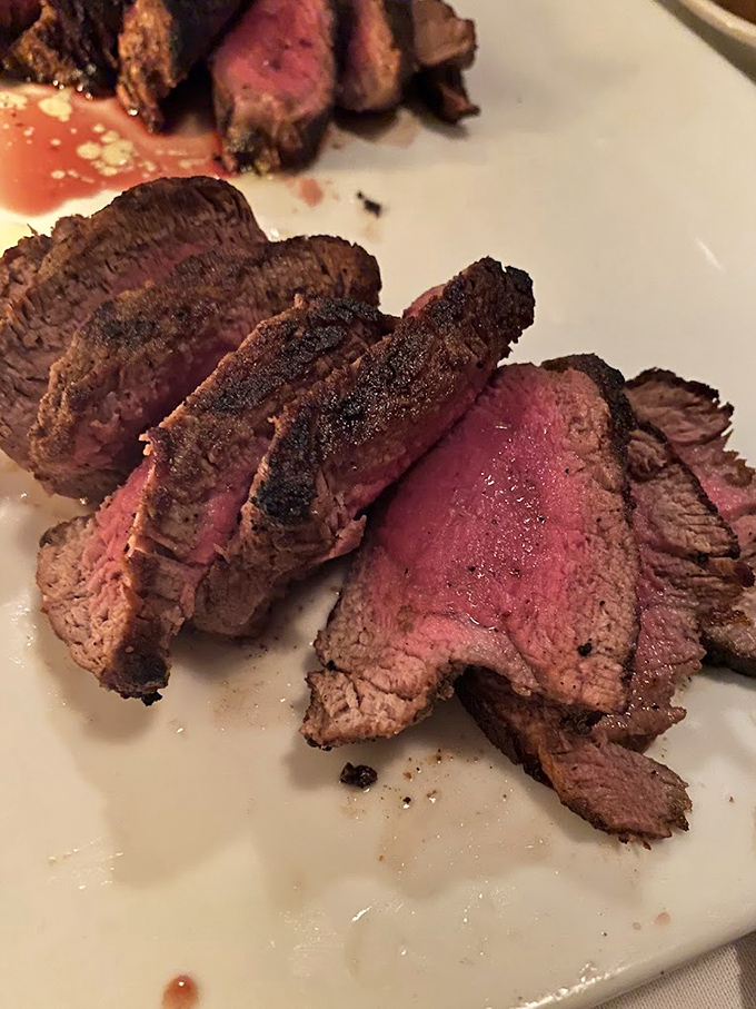 Perfectly sliced medium-rare steak revealing that gorgeous pink center&mdash;the kind that makes vegetarians question their life choices. 