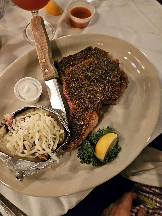 This isn't just a steak; it's a masterpiece with a crusty exterior giving way to perfectly pink insides. The loaded potato isn't playing second fiddle either.