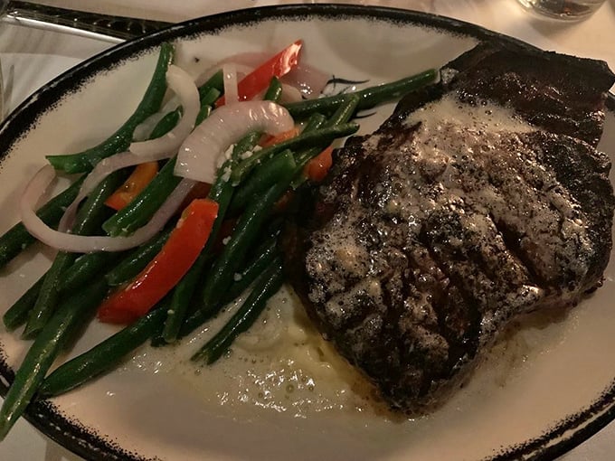 A perfectly char-grilled steak shares the plate with vibrant vegetables&mdash;proof that sometimes the simplest preparations yield the most profound pleasures.