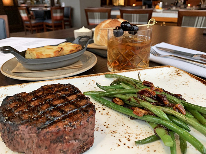 A perfectly grilled steak with those coveted crosshatch marks sits alongside vibrant green beans&mdash;proof that simplicity, done right, is culinary genius.