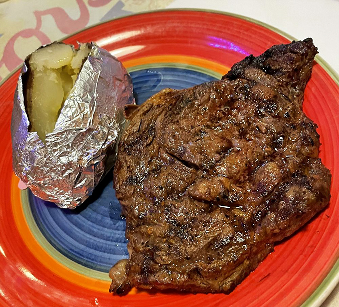This isn't just a steak; it's a masterpiece of meat chemistry&mdash;perfectly charred exterior, juicy interior, and a baked potato sidekick.