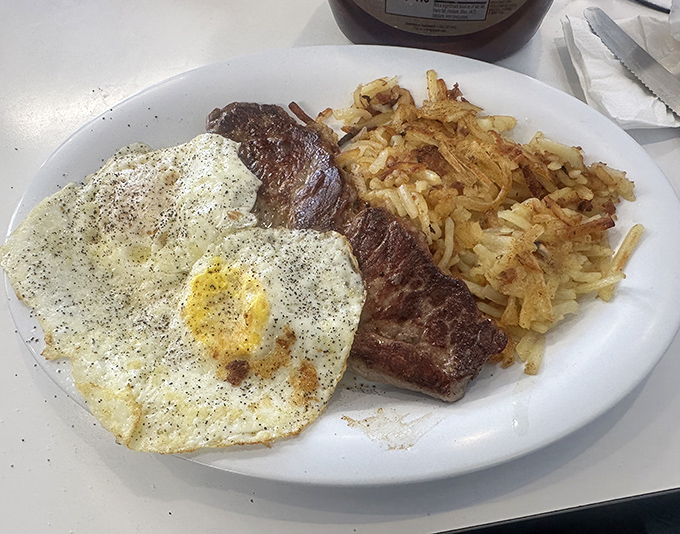 The star of the show: steak and eggs that would make Ron Swanson weep with joy. Notice how the yolk is just waiting to break over those crispy hashbrowns.