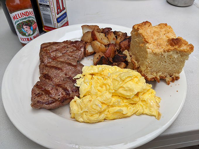 Steak and eggs: where breakfast meets dinner and they both decide to throw a party on your plate. That cornbread looks like it could start a religion.