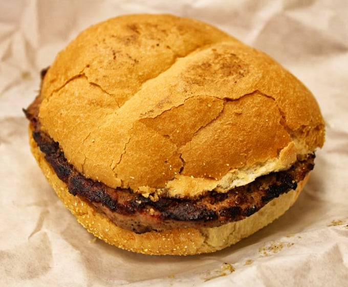 Behold the steak sandwich that launched a thousand satisfied sighs &ndash; charcoal-kissed perfection on a bun.