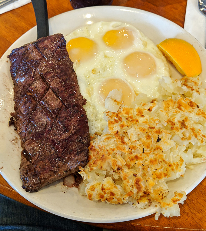 Behold the star attraction: a perfectly seared steak alongside sunny-side-up eggs. Those crispy hash browns aren't playing a supporting role&mdash;they're co-stars.