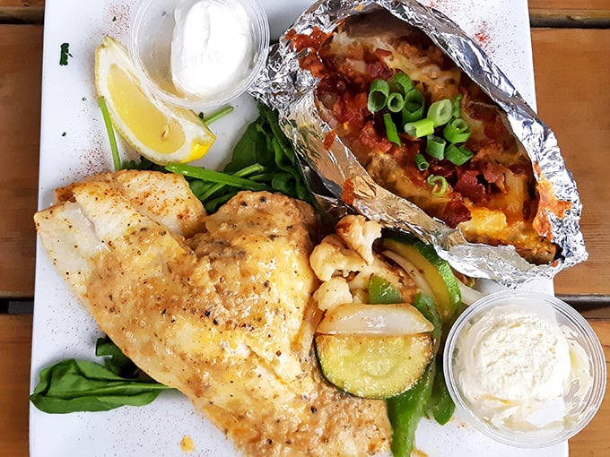The star of the show: perfectly flaky flounder alongside a loaded baked potato. Seafood this good should have a passport stamp.