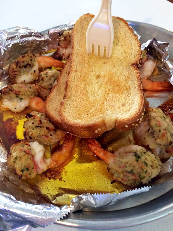 Seafood doesn't get more straightforward than this: plump shrimp, seasoned to perfection, served with a slice of bread that's basically saying, "You're welcome."