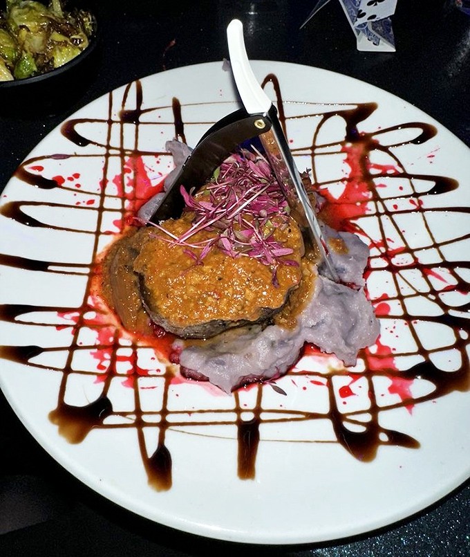 The legendary Sweeney Beef arrives like edible art, complete with dramatic sauce presentation flourishes.