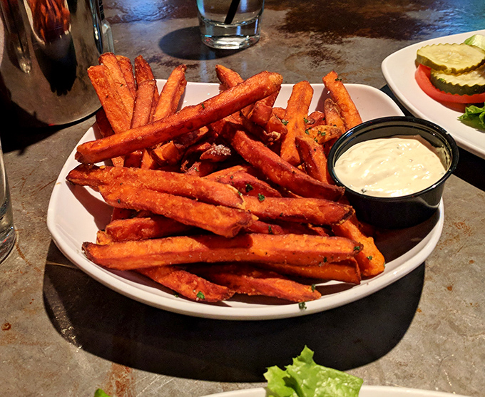 Golden perfection arrives with horseradish mustard sauce, proving sweet potatoes deserve serious respect and admiration.