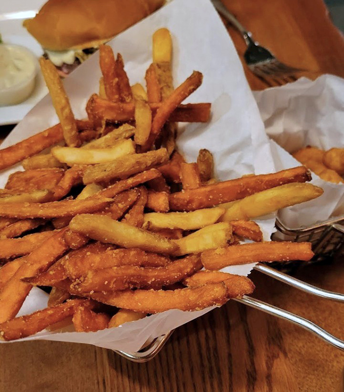 Sweet potato fries that achieve the impossible: perfectly crisp exterior, tender inside. These aren't just side dishes; they're the supporting actors who steal the show.