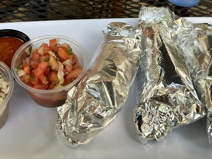 Foil-wrapped treasures flanked by fresh pico de gallo&mdash;proof that sometimes the best gifts come in simple packages.