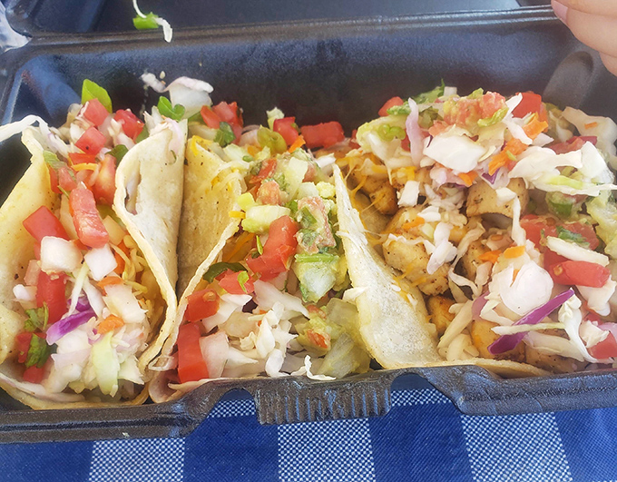 These tacos don't need a passport to deliver authentic flavor. Fresh, vibrant, and piled high with enough toppings to require strategic first-bite planning.