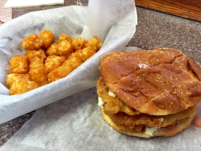 Comfort food companions: Crispy tater tots and that legendary tenderloin sandwich create the Midwest's most perfect lunch duet.