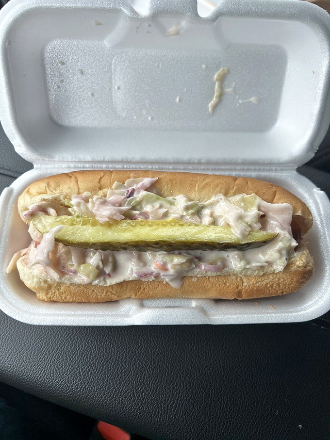 Not your average hot dog! This creamy, pickle-topped creation proves that Lipuma's isn't afraid to venture beyond traditional coney territory.