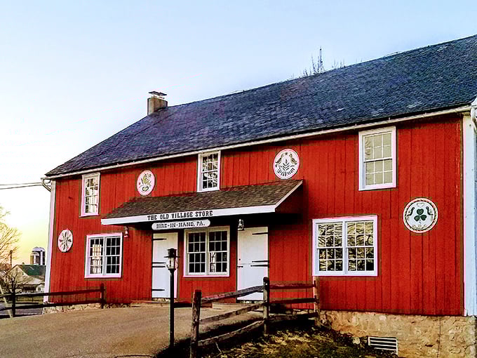 The Old Village Store's vibrant red exterior isn't just a building; it's a living museum where hex signs tell stories older than your grandmother's recipes.