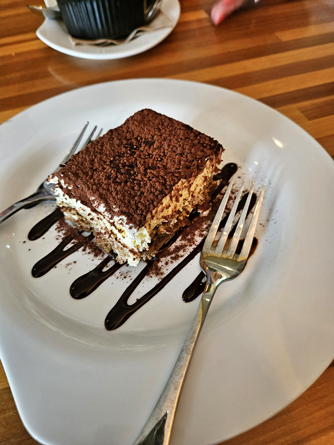 Tiramisu that makes time stand still. Perfectly soaked ladyfingers, cloud-like mascarpone, and cocoa dusting that would make nonna weep with joy.
