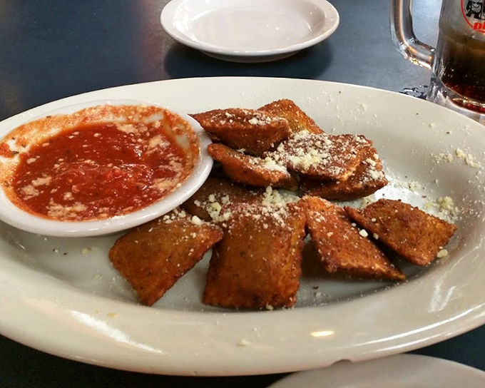 Golden-brown toasted ravioli, St. Louis's gift to the culinary world. Crispy outside, tender inside, with a dusting of parmesan that makes everything better.