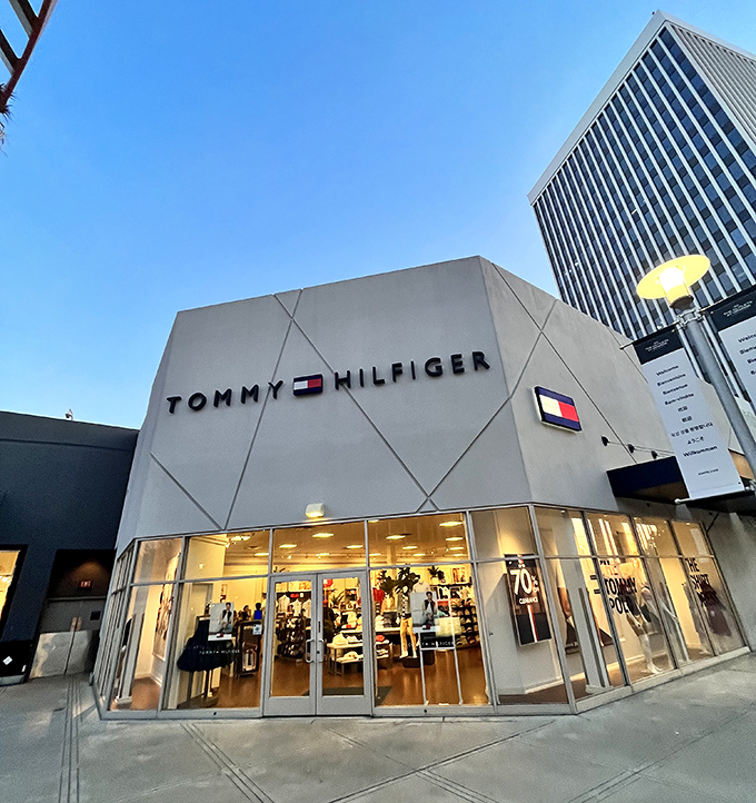 Tommy Hilfiger's sleek corner location showcases classic American style at prices that make you feel like you've outsmarted the retail gods.