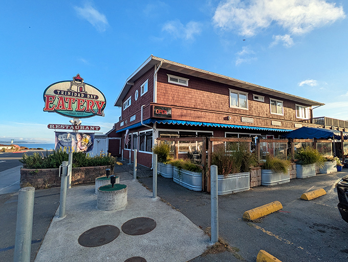 Trinidad Bay Eatery beckons with rustic charm, promising fresh coastal flavors in an authentically weathered setting.