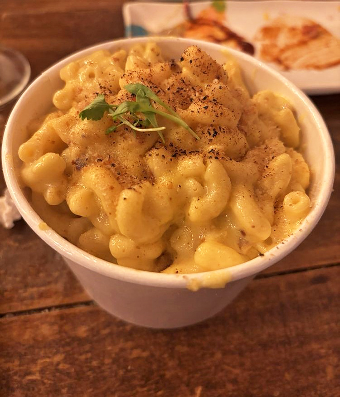 Truffle mac and cheese that makes you question all other pasta experiences. That little herb garnish is just showing off at this point.