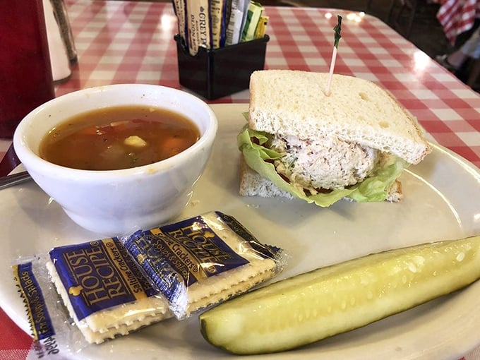 Simple pleasures done right—a perfectly executed tuna sandwich with homemade soup that would make your grandmother nod in approval.
