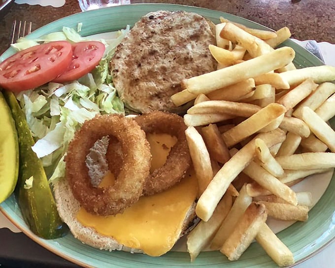 This isn't just a turkey burger; it's a masterclass in diner engineering with those perfectly crisp onion rings standing guard.