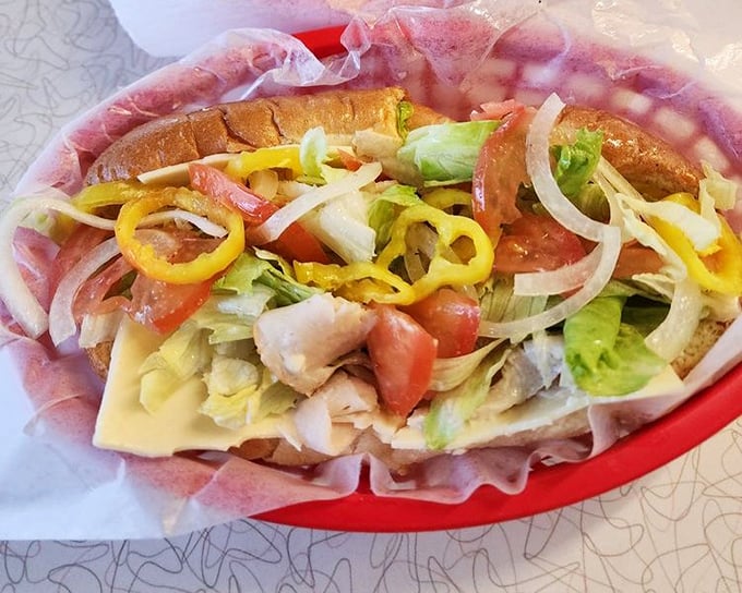 This turkey sub isn't just lunch; it's a masterclass in balance. Fresh veggies provide the crunch, meat provides the substance, and banana peppers deliver that perfect zing.